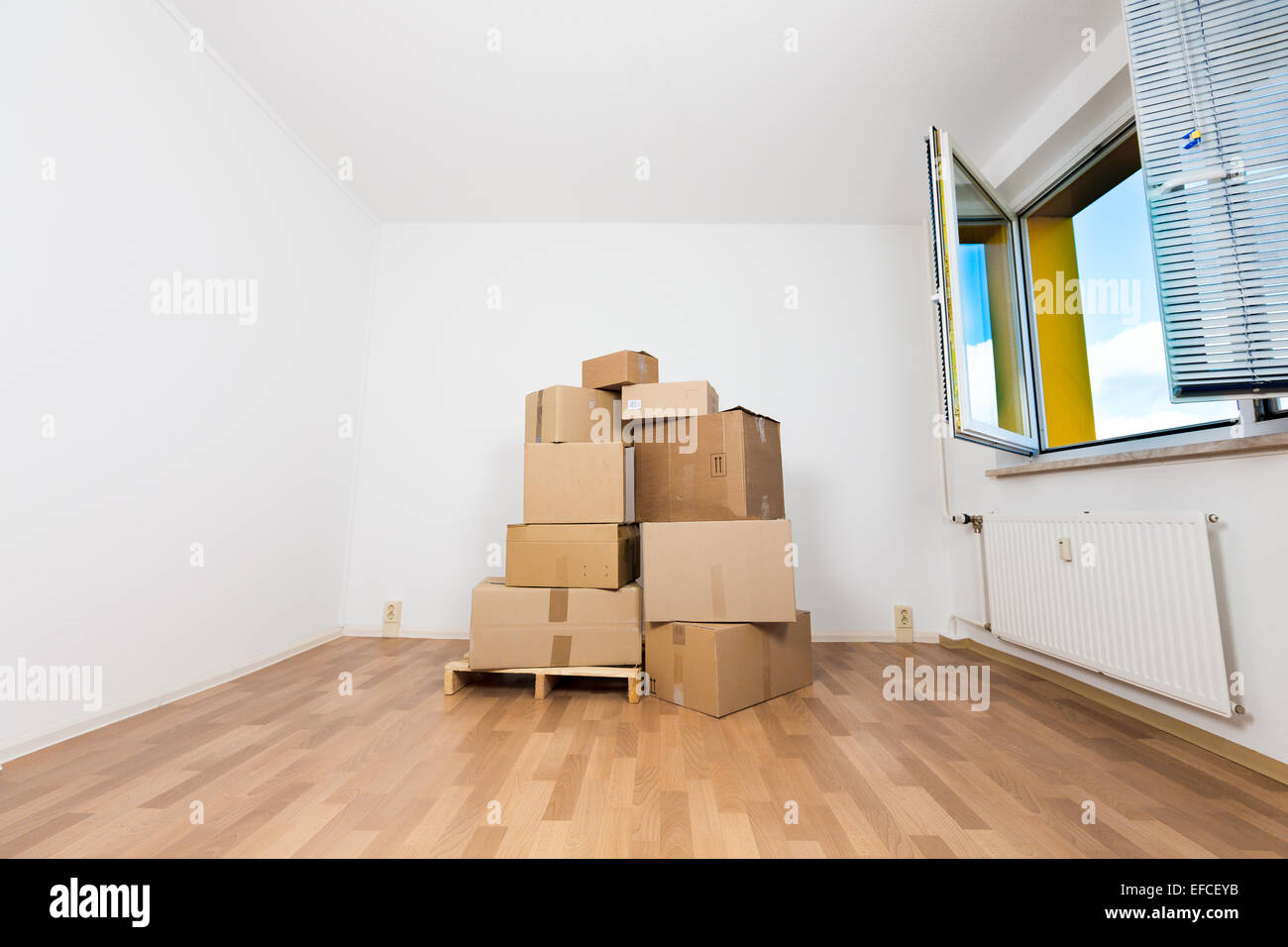 cardboard boxes in an empty apartment. moving to a new apartment Stock ...