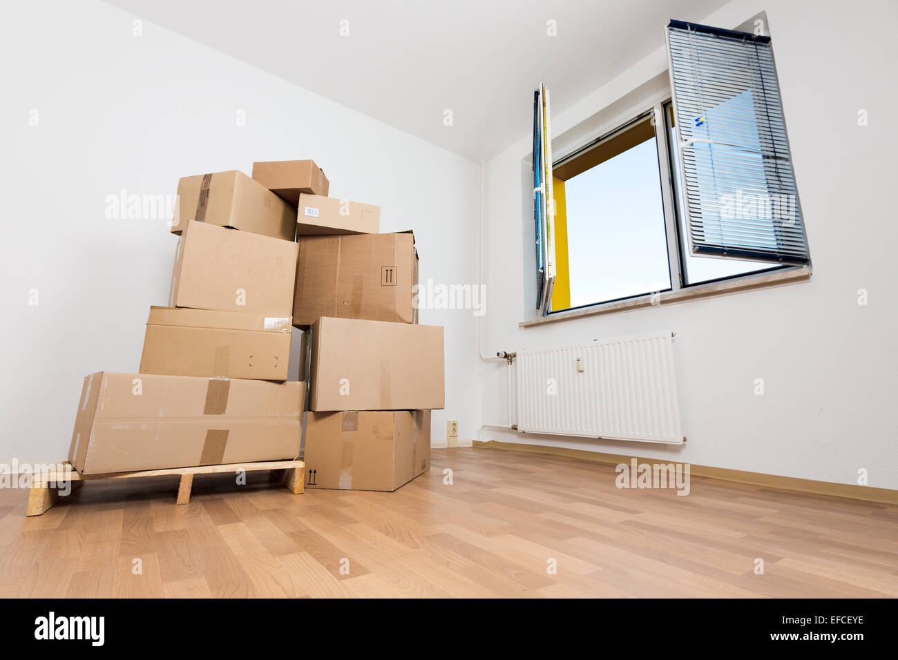 cardboard boxes in an empty apartment. moving to a new apartment Stock ...