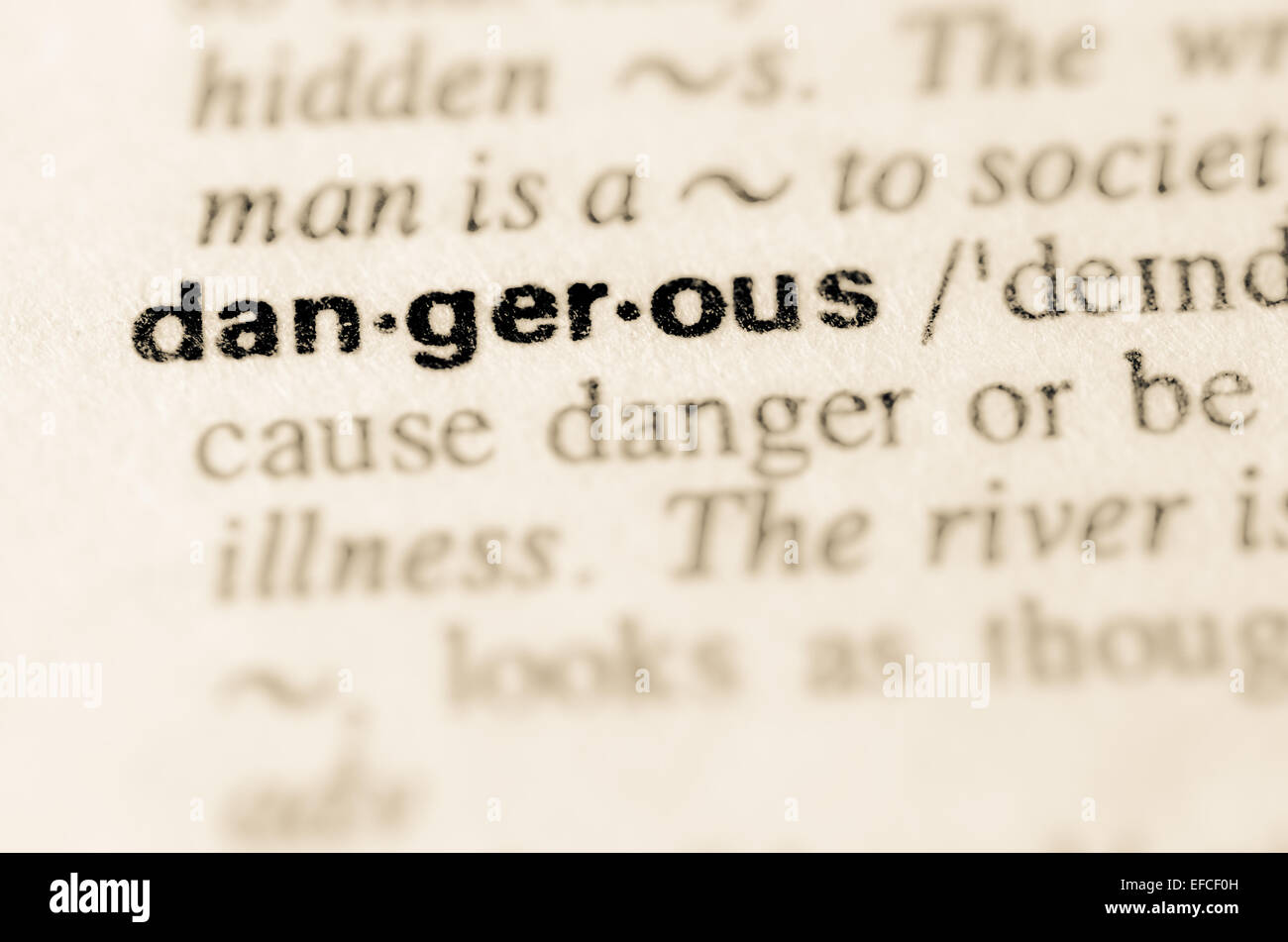 Definition of word dangerous in dictionary Stock Photo - Alamy