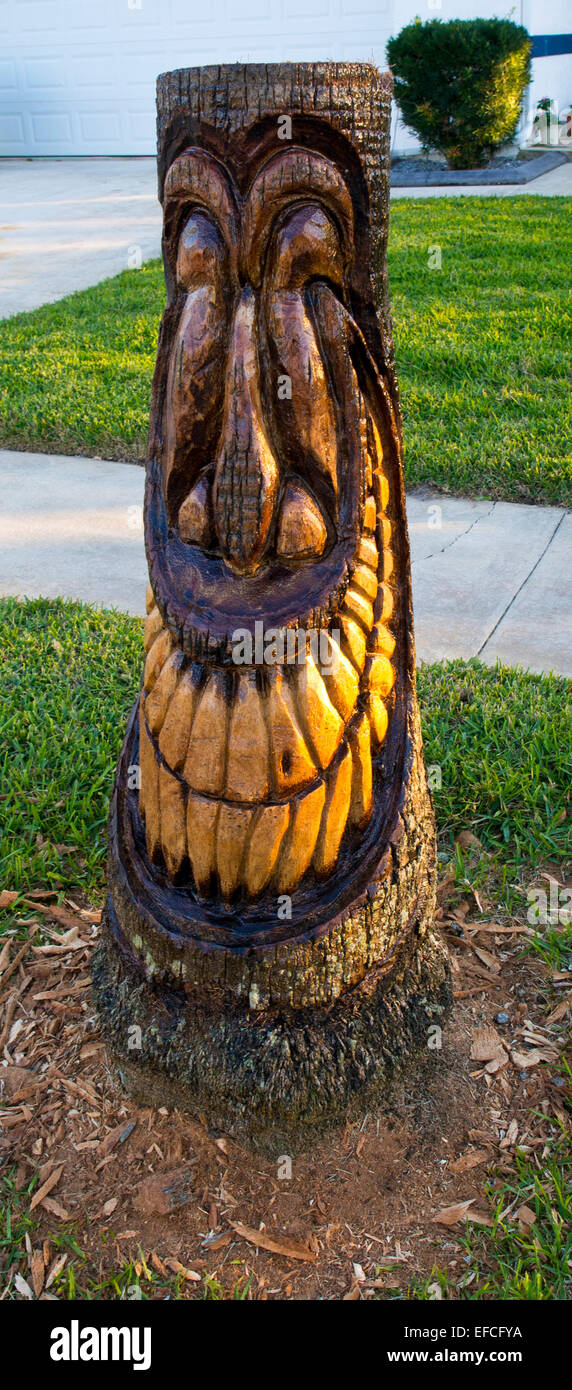 A happy Tiki from a Palm Tree Stump Stock Photo - Alamy