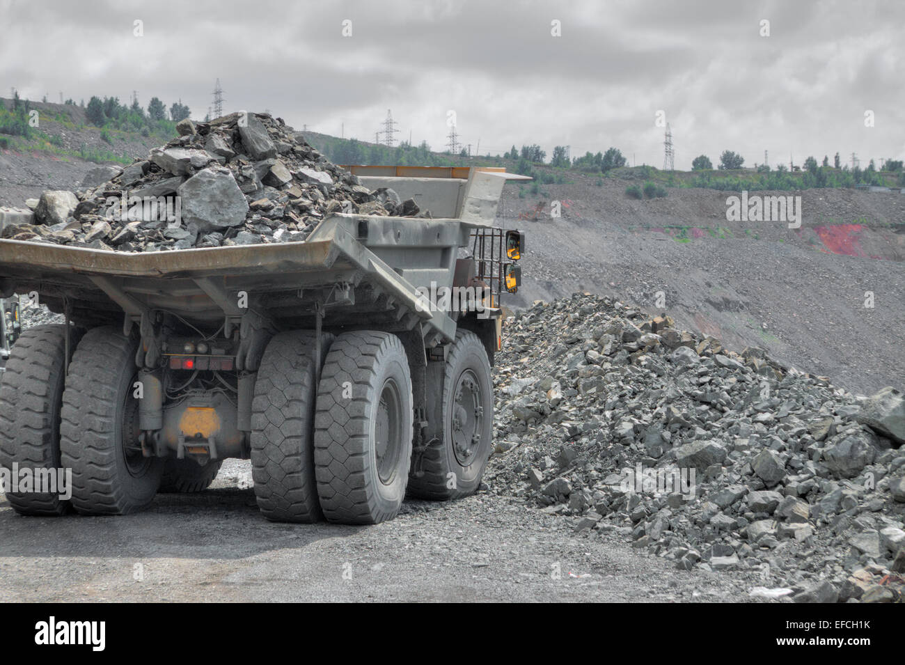 Heavy mining truck loaded with iron ore on the opencast quarry Stock ...