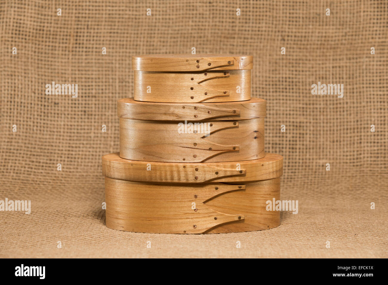 Collection of three hand-crafted shaker boxes stacked in front of a ...
