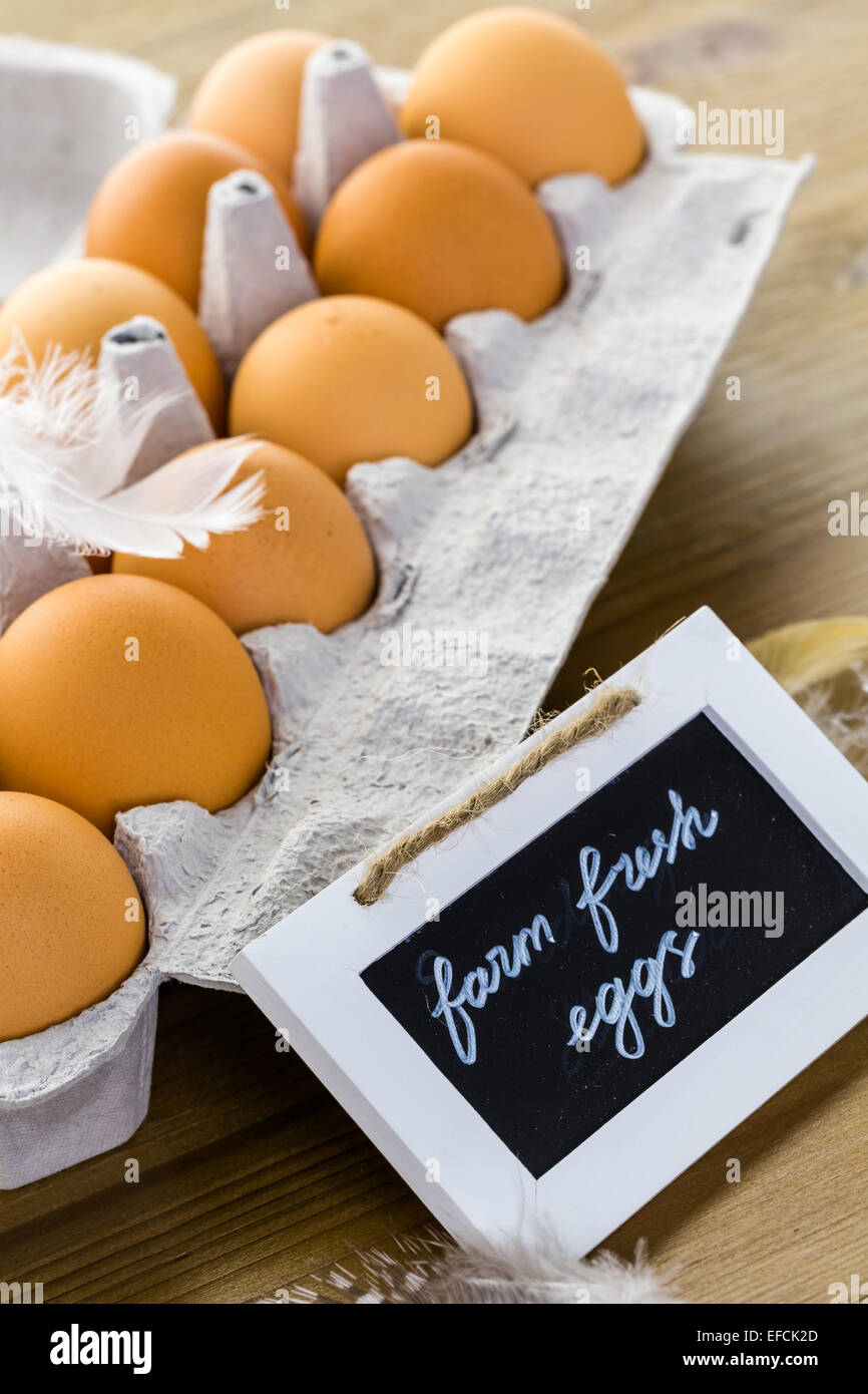 Fresh farm eggs on the wood table Stock Photo - Alamy