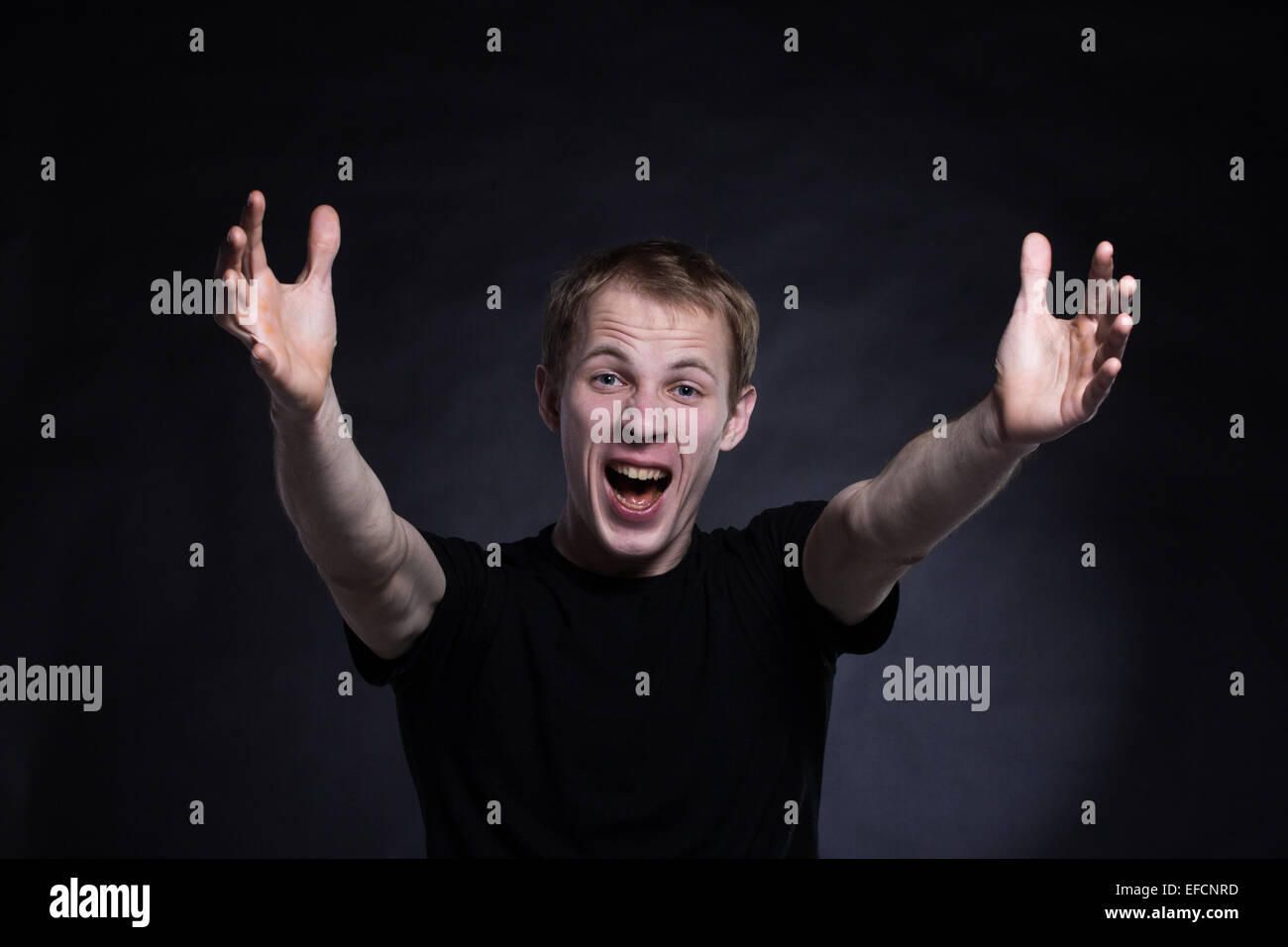 man winner pose on black background Stock Photo - Alamy