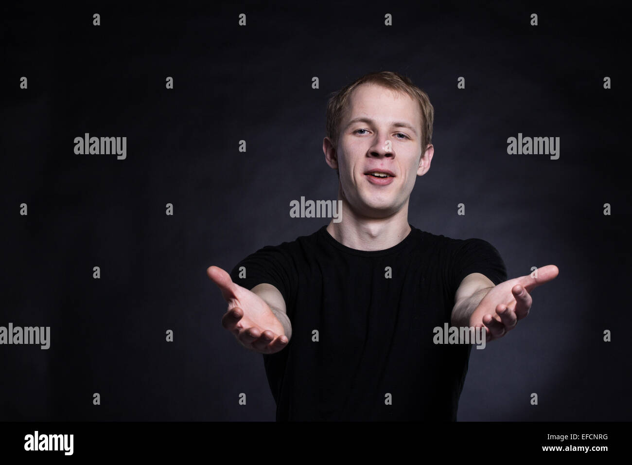 man winner pose on black background Stock Photo - Alamy