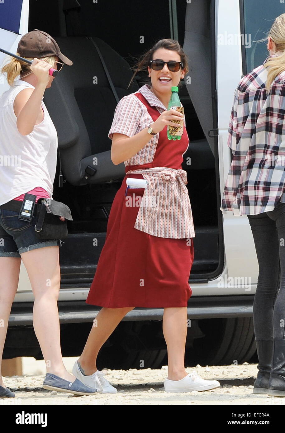 Lea Michele is seen wearing a waitress outfit and smoking cigarettes ...