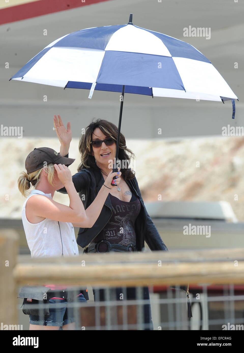 Lea Michele is seen wearing a waitress outfit and smoking cigarettes ...