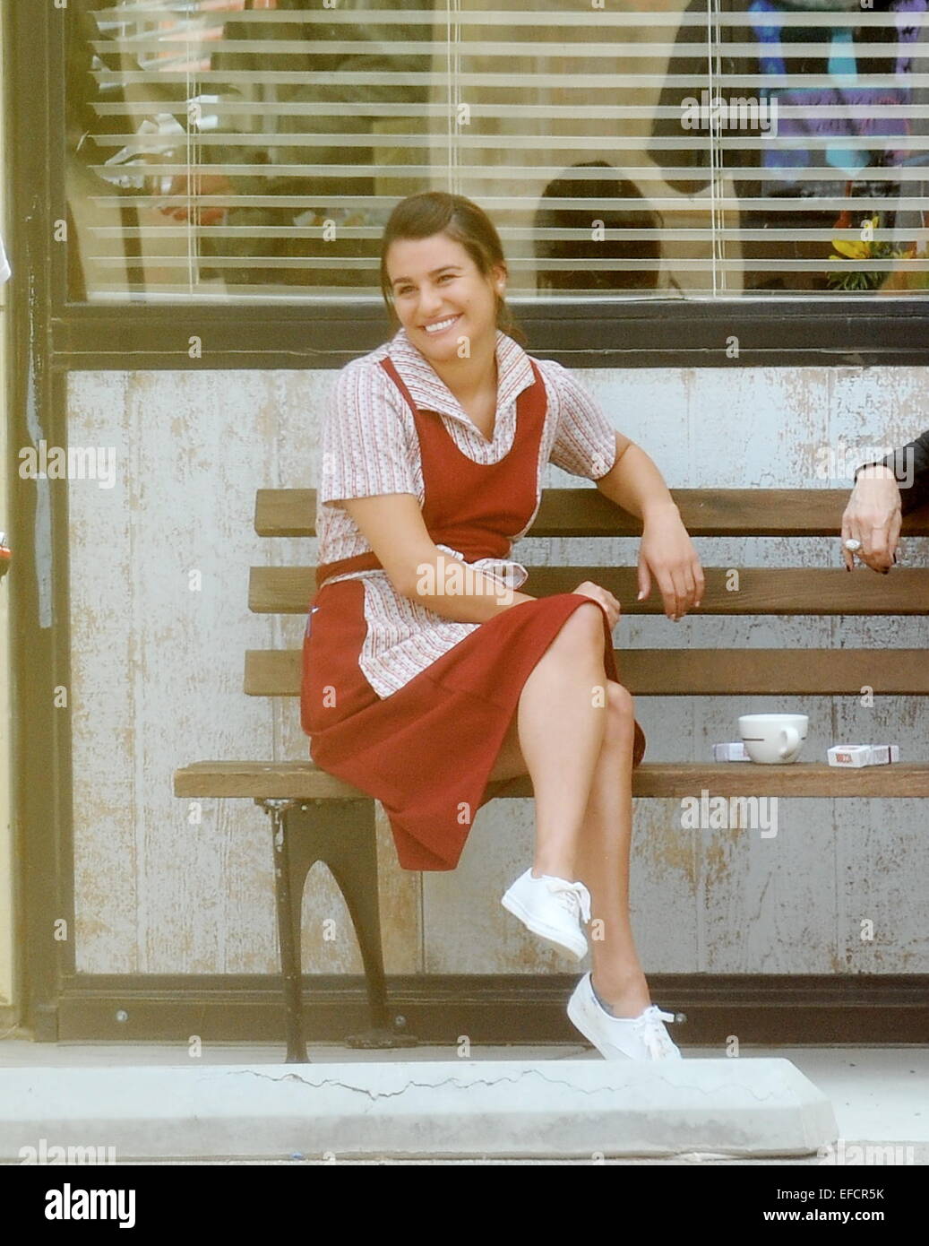 Lea Michele is seen wearing a waitress outfit and smoking cigarettes ...