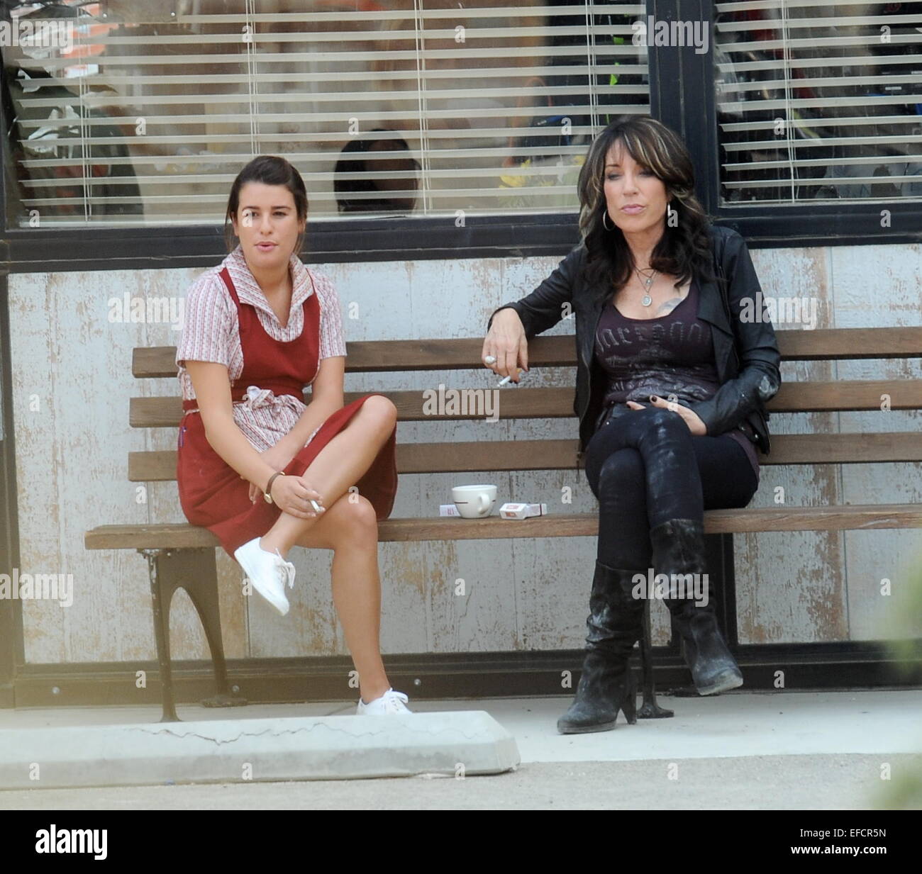 Lea Michele is seen wearing a waitress outfit and smoking cigarettes ...