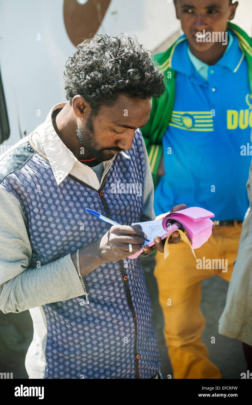 Seller of the bus tickets, Addis Ababa, Ethiopia, Africa Stock Photo ...
