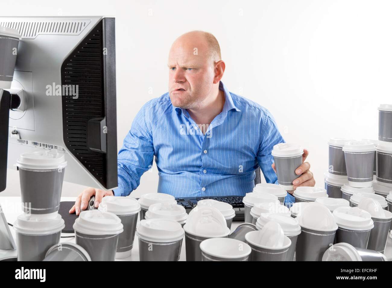 Hardworking and focused businessman at office Stock Photo - Alamy