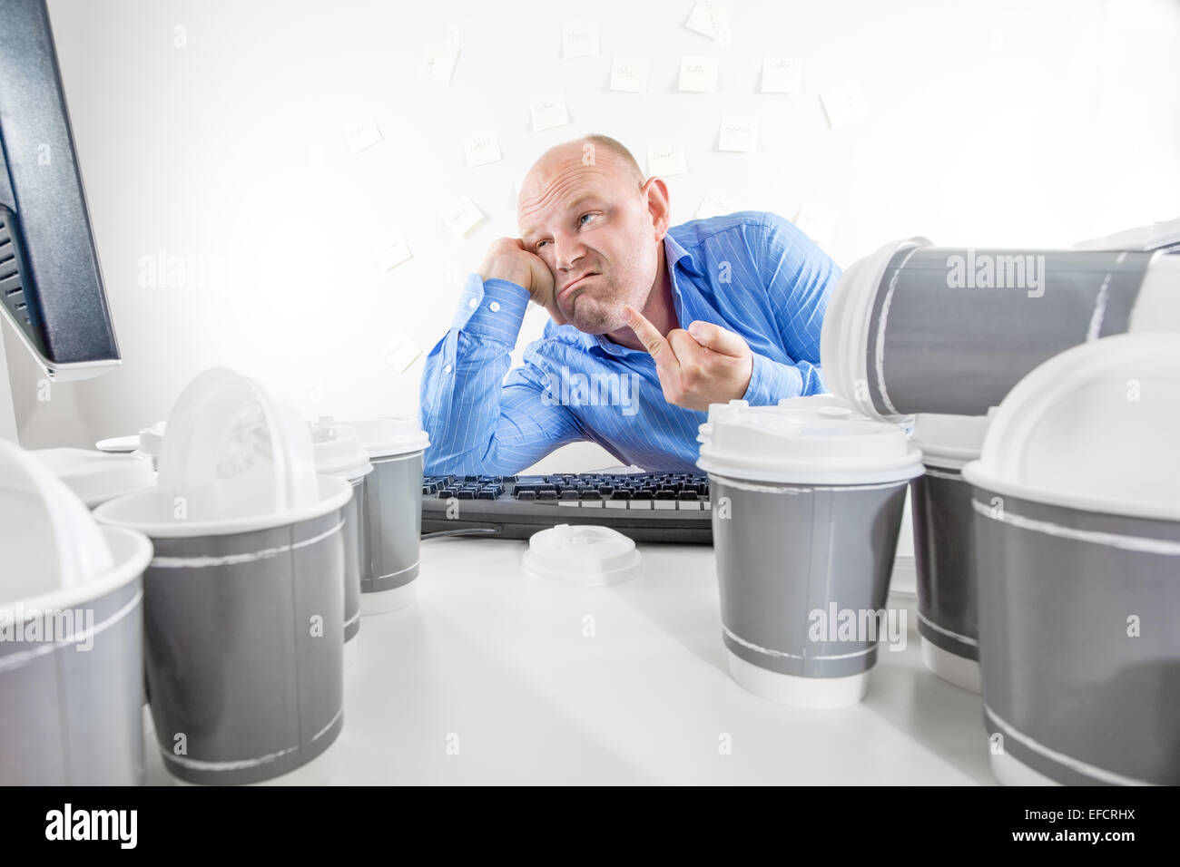 Overworked and angry businessman gives finger Stock Photo - Alamy Overworked and angry businessman gives finger Stock Photo - Alamy