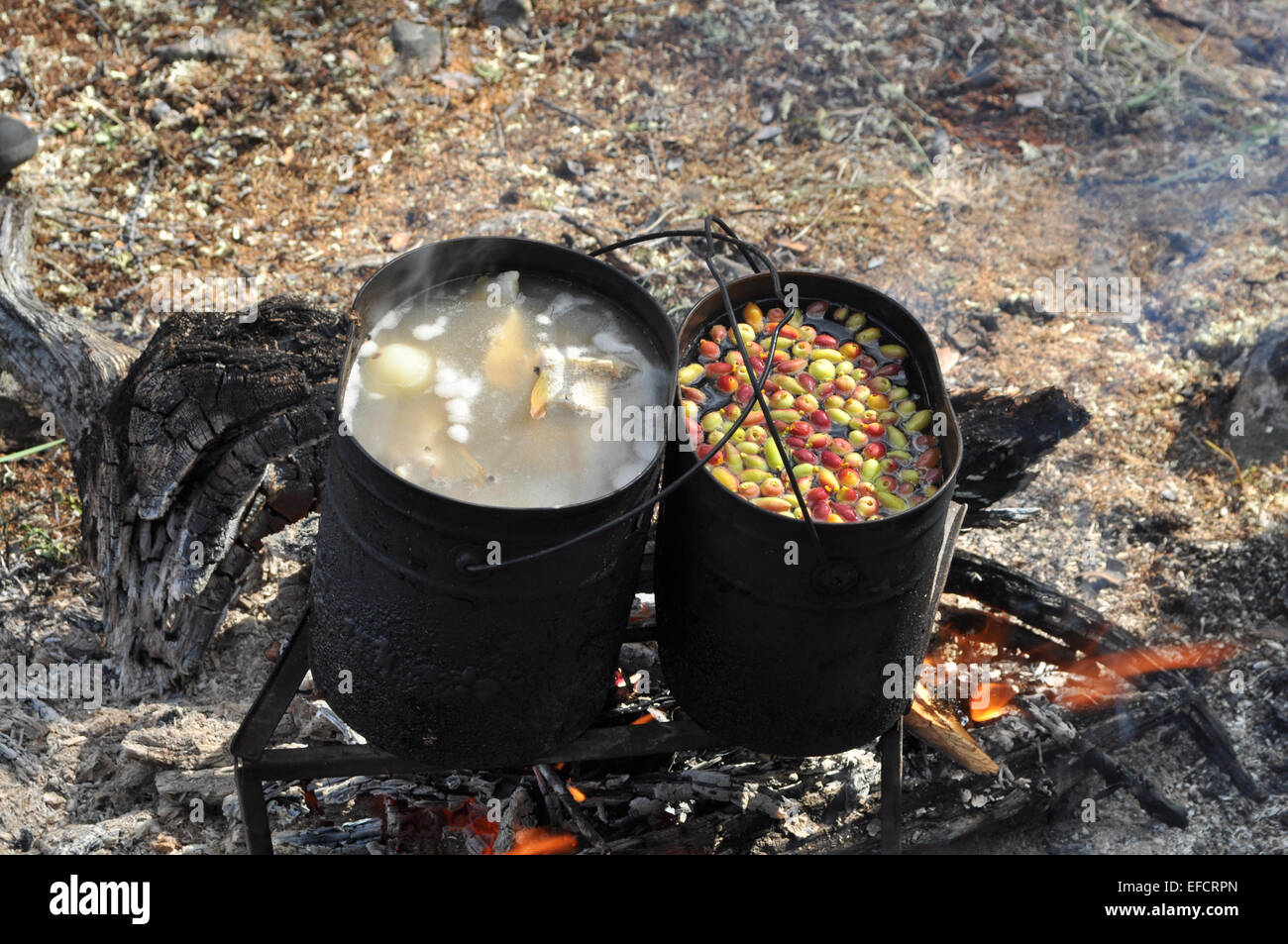 Cooking on a fire. Cooking in field conditions spur the imagination of ...