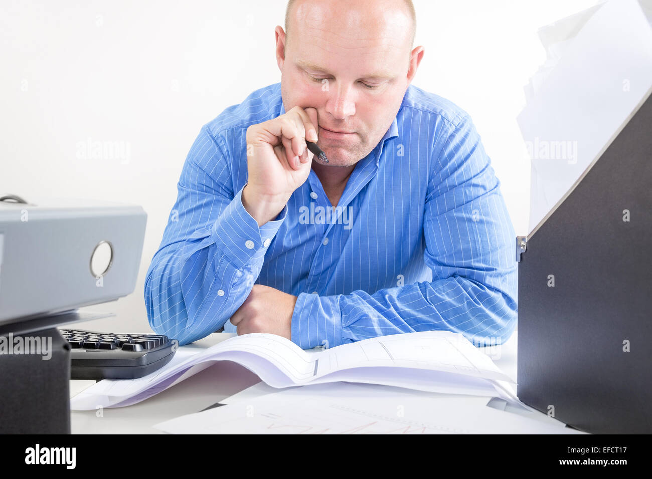 Hard working businessman at the office Stock Photo - Alamy