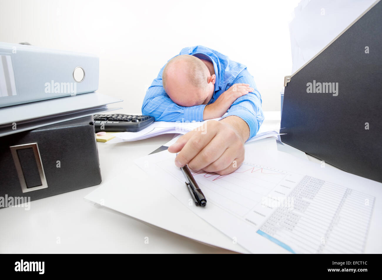 Overworked and tired businessman at the office Stock Photo - Alamy