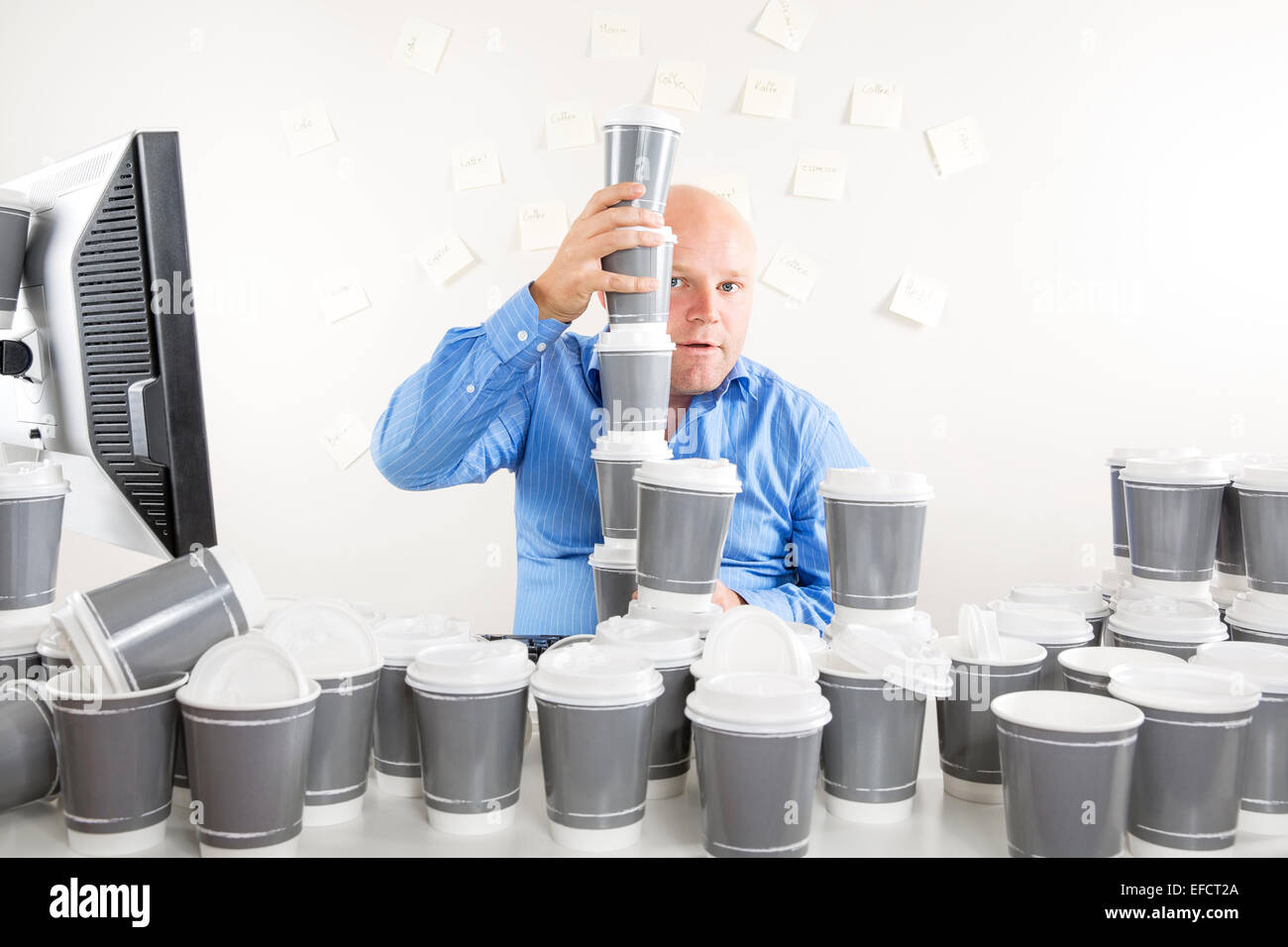 Businessman with extreme coffee addiction Stock Photo - Alamy