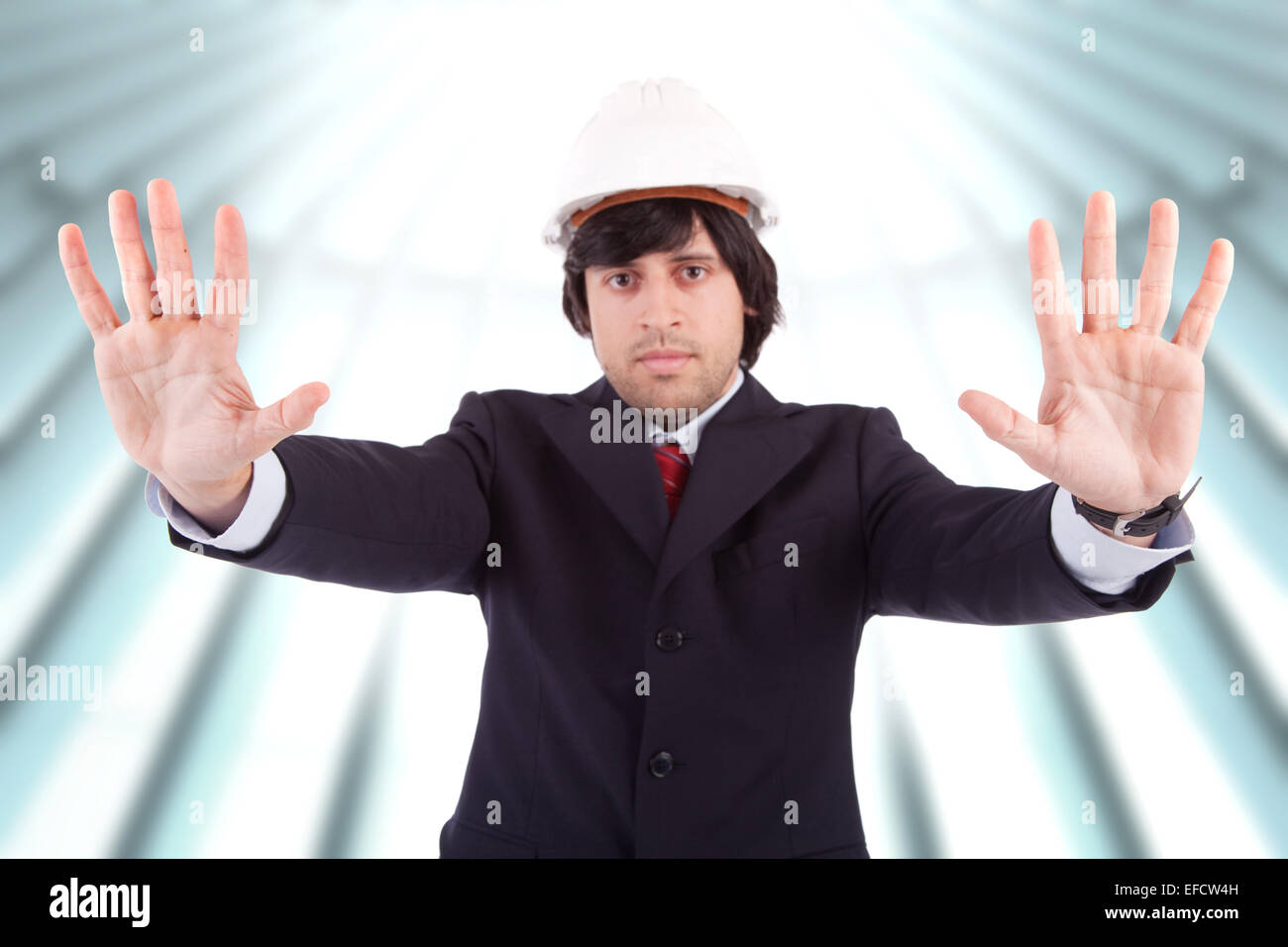 Business man making stop sign, isolated Stock Photo - Alamy