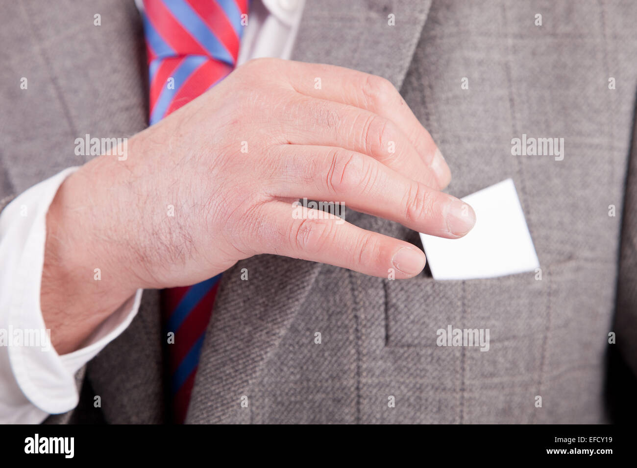 Business man offering card - focus on the hand Stock Photo - Alamy