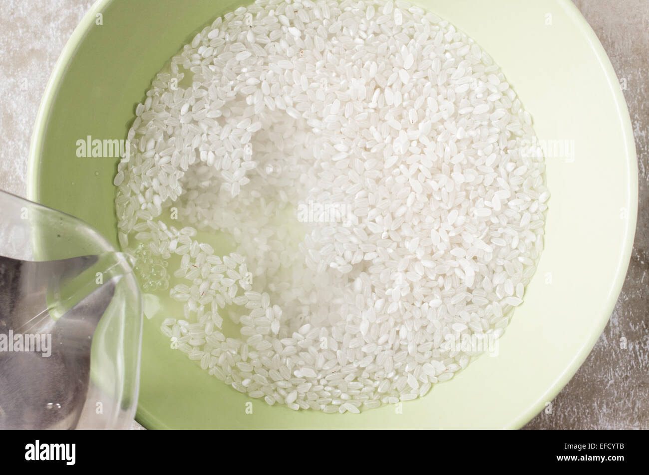 Washing with clean water in the rice bowl of green Stock Photo - Alamy