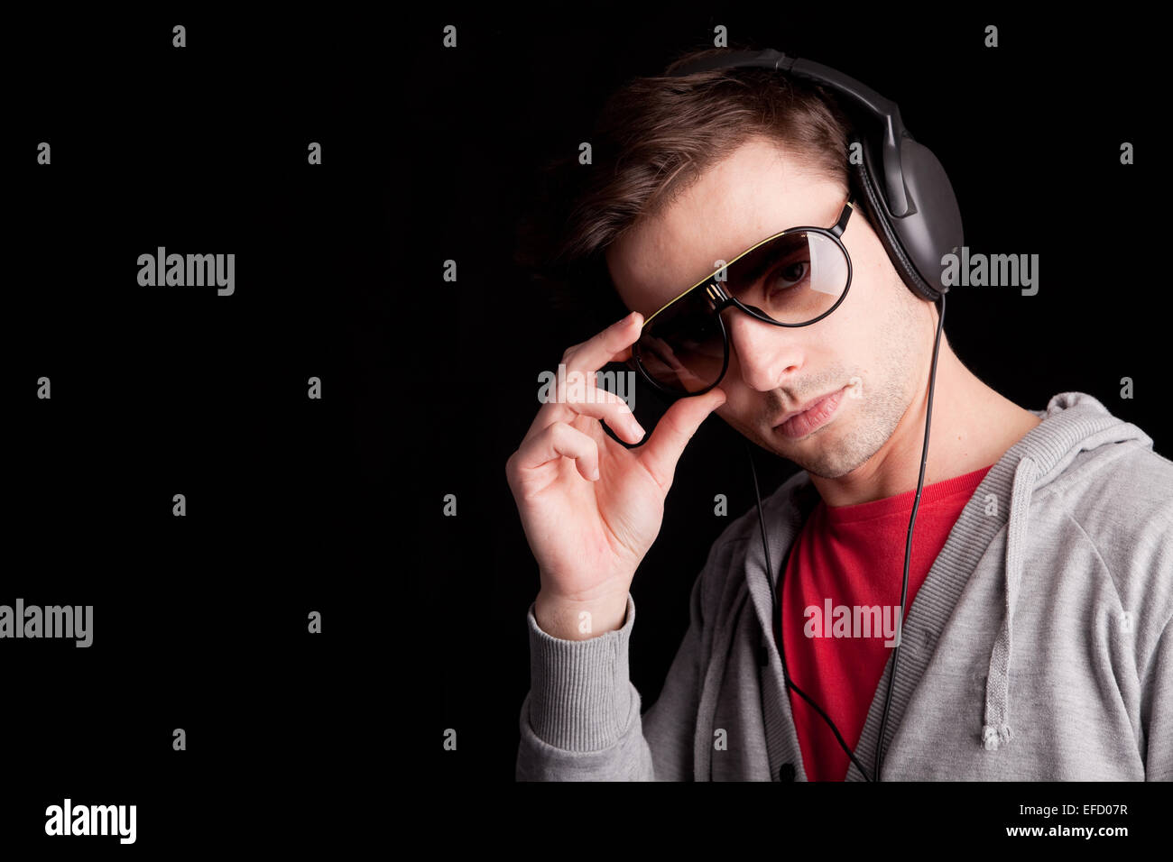 Young man listening to music - isolated Stock Photo - Alamy