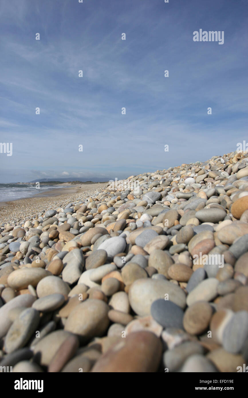 Beach perspective with blue sky background Stock Photo - Alamy