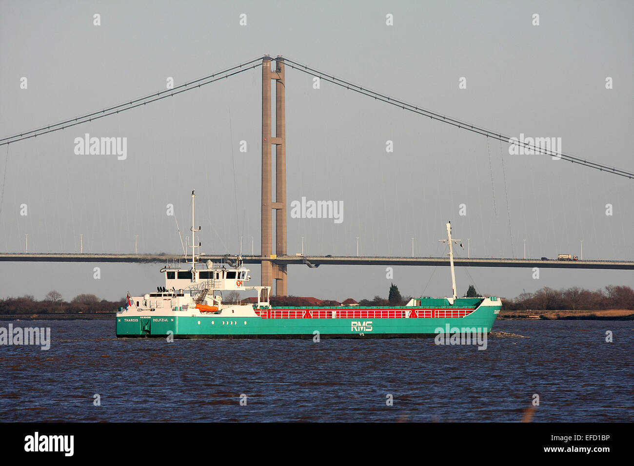 Maritime trade vessel on river Humber with Humber bridge Stock Photo ...