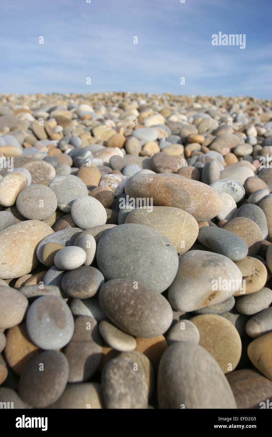 Beach perspective with blue sky background Stock Photo - Alamy
