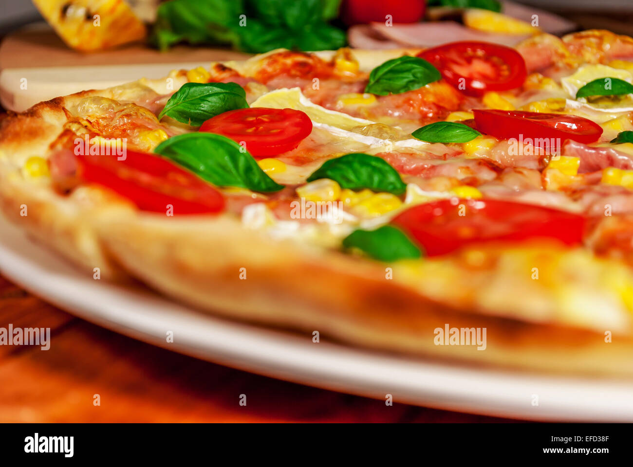 Italian traditional pizza with cheese and tomato Stock Photo - Alamy