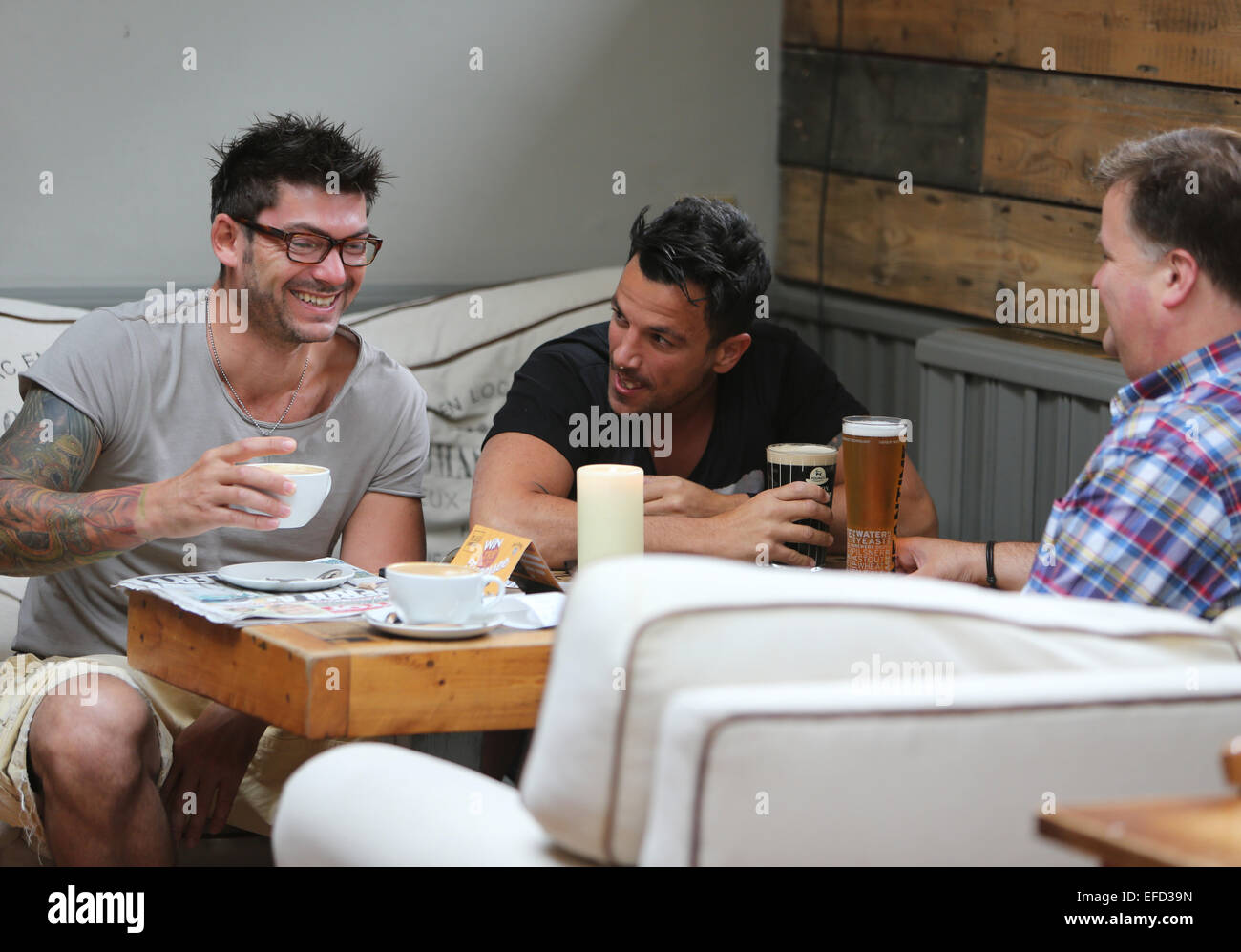 Peter Andre enjoys a drink with friends in a pub opposite the ITV ...