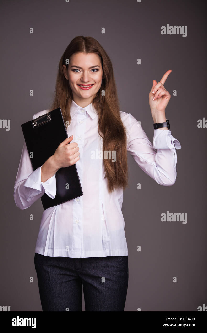Woman pointing at something Stock Photo - Alamy