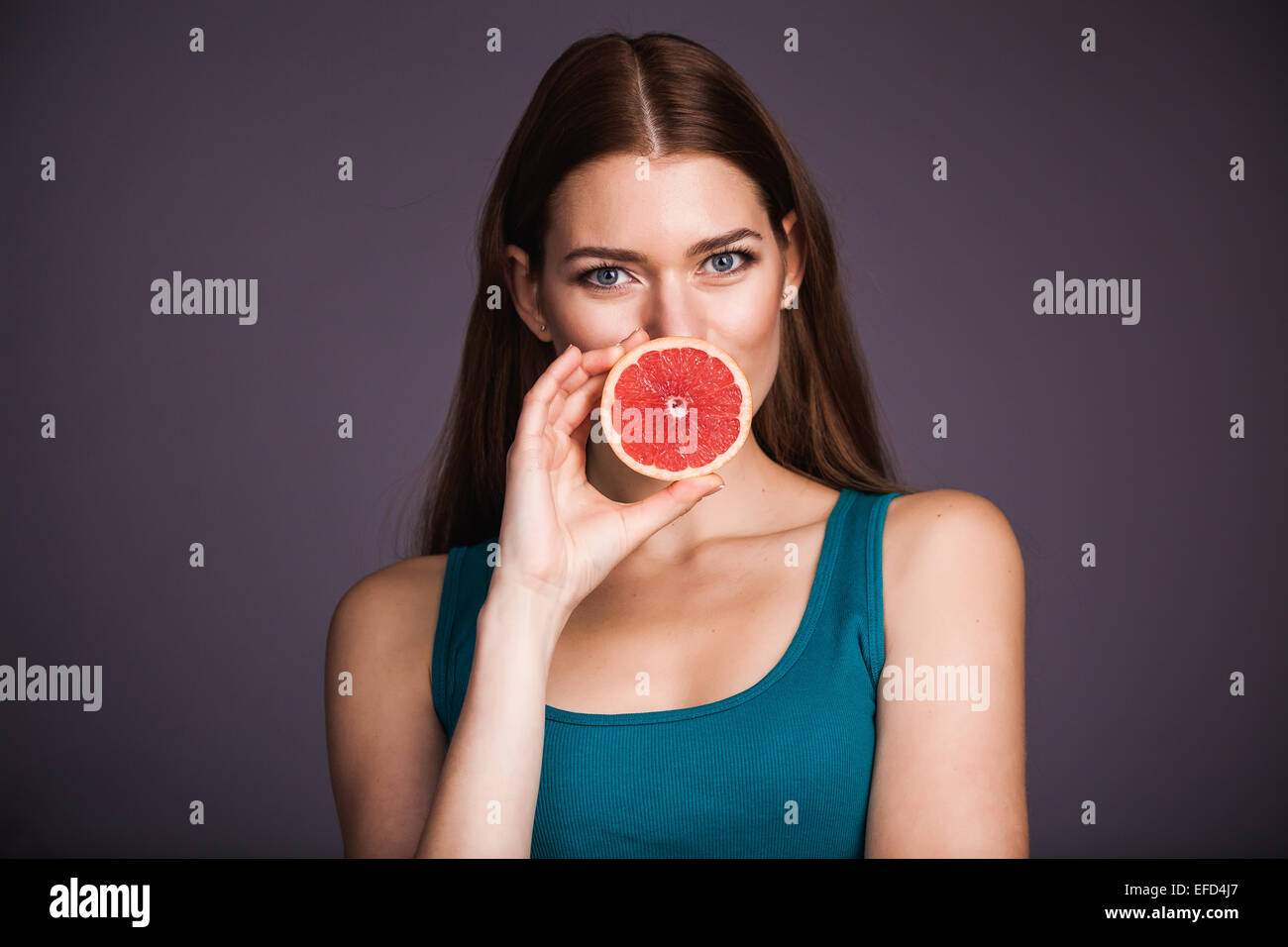 Woman with grapefruit Stock Photo - Alamy