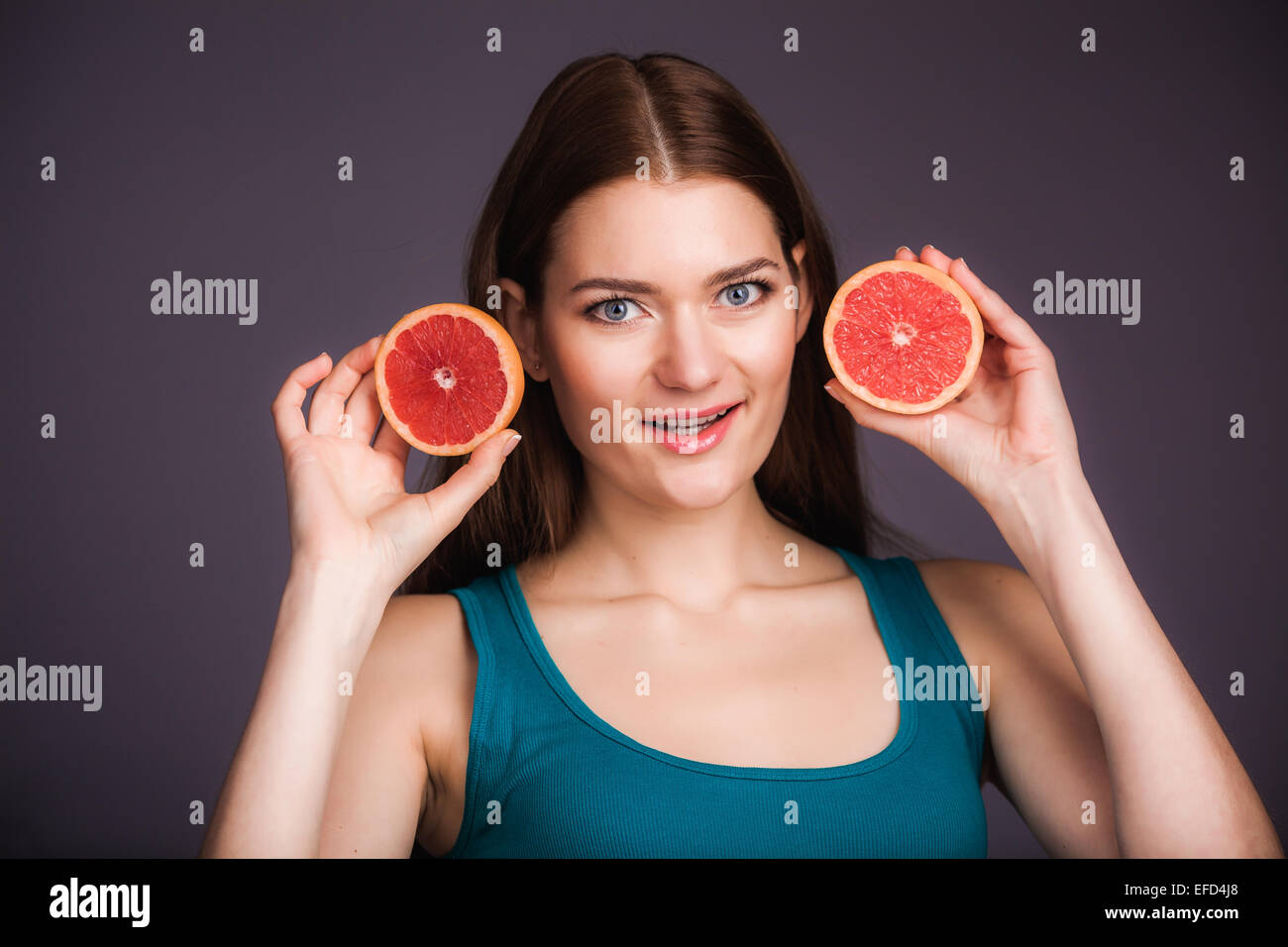 Woman with grapefruit Stock Photo - Alamy
