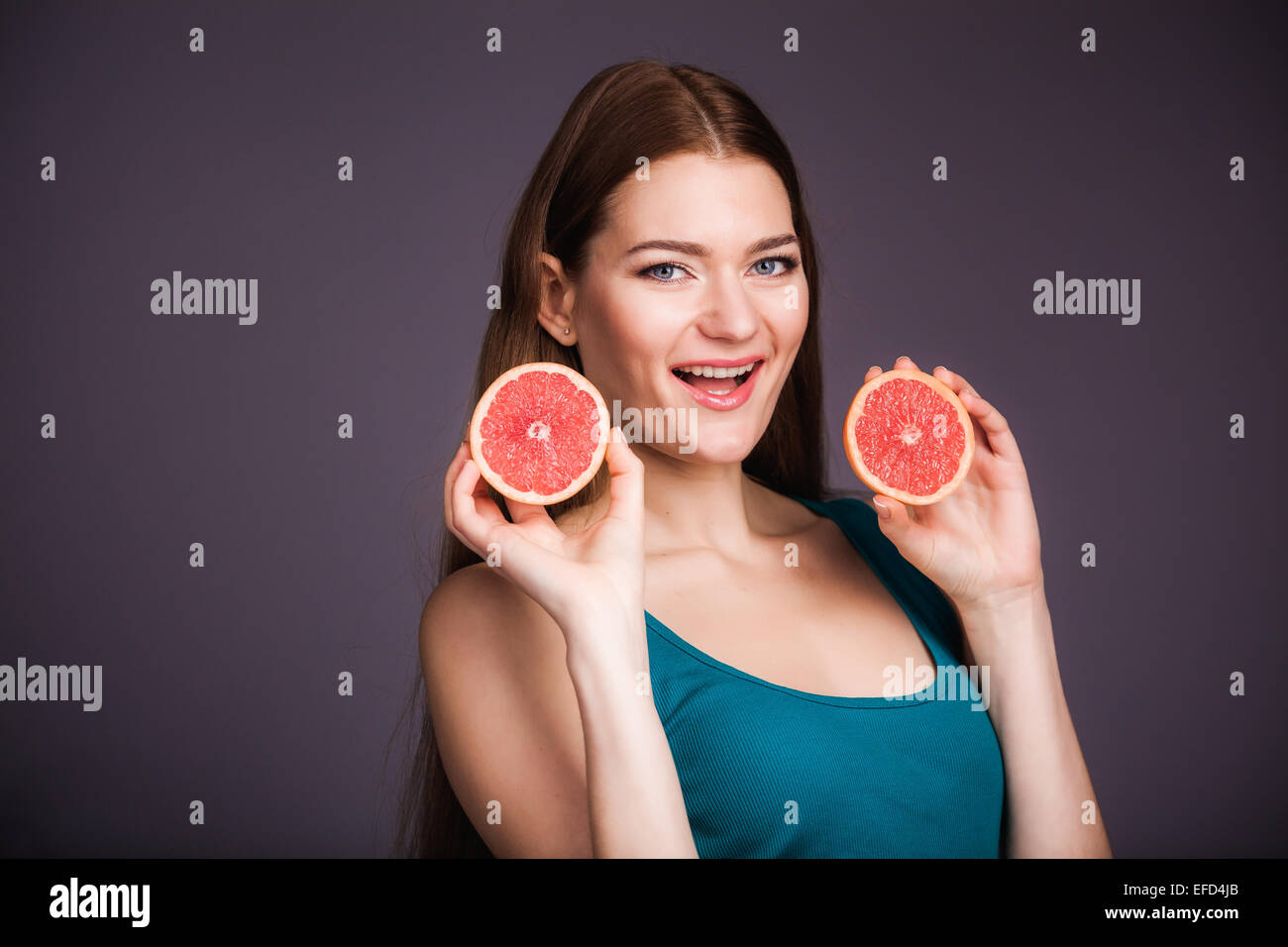Woman with grapefruit Stock Photo - Alamy