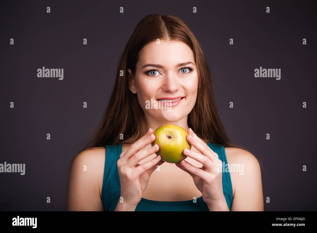 Woman holding apple Stock Photo - Alamy