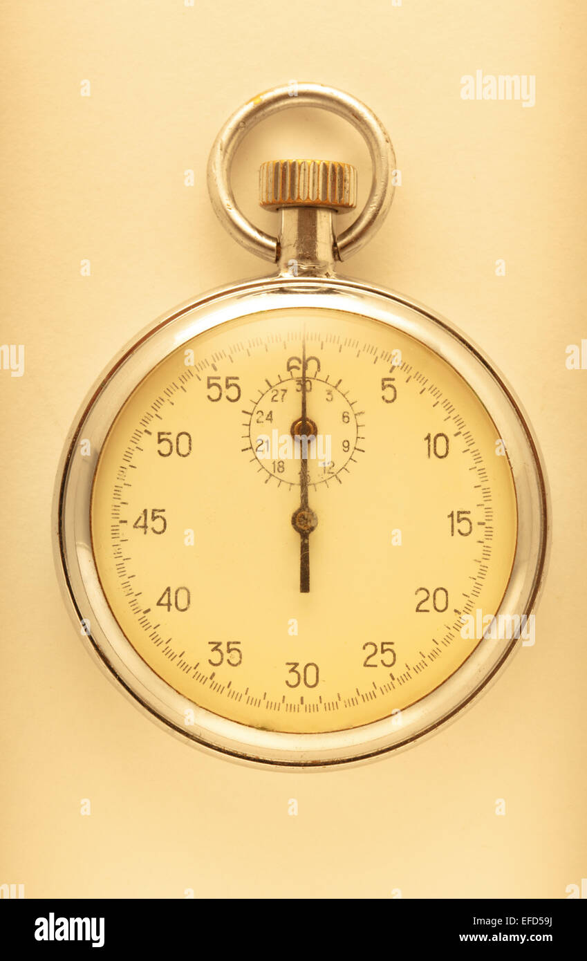 Stopwatch closeup on the light beige background Stock Photo - Alamy