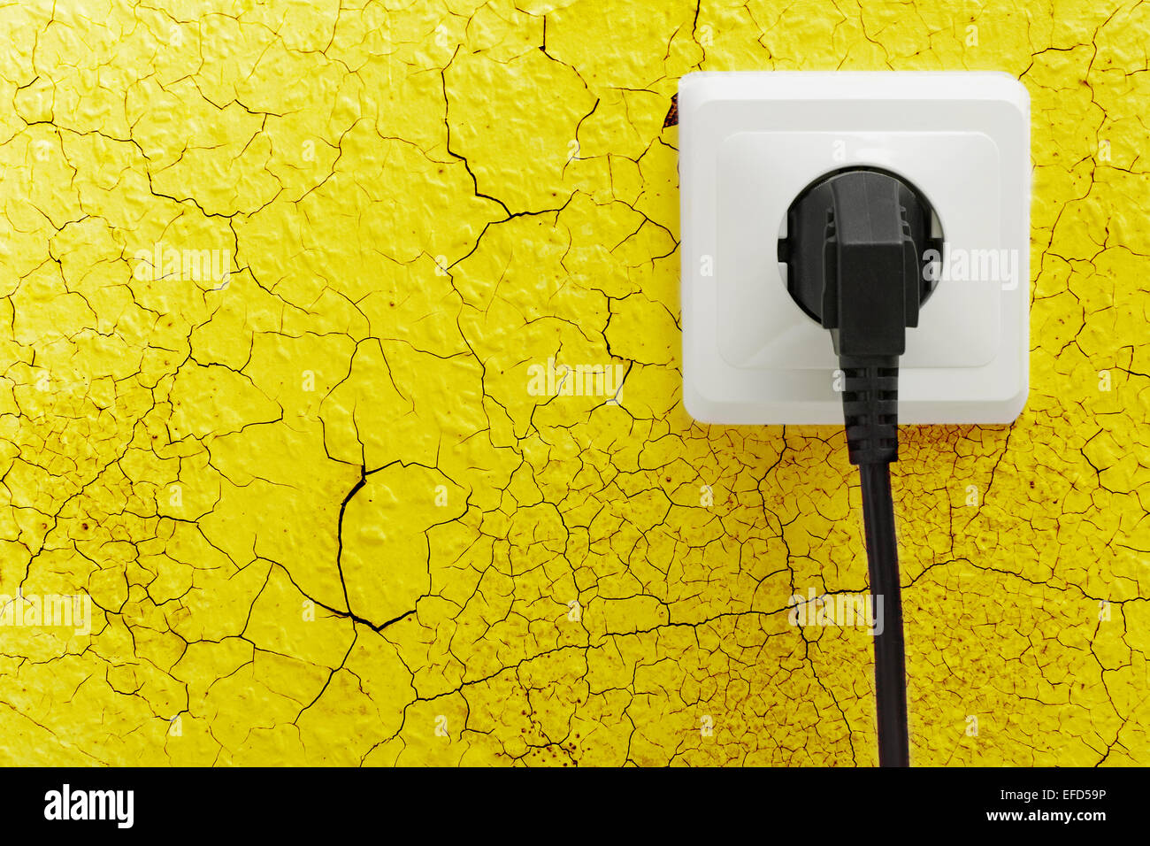 Wall plug socket on cracked colored wall background Stock Photo - Alamy