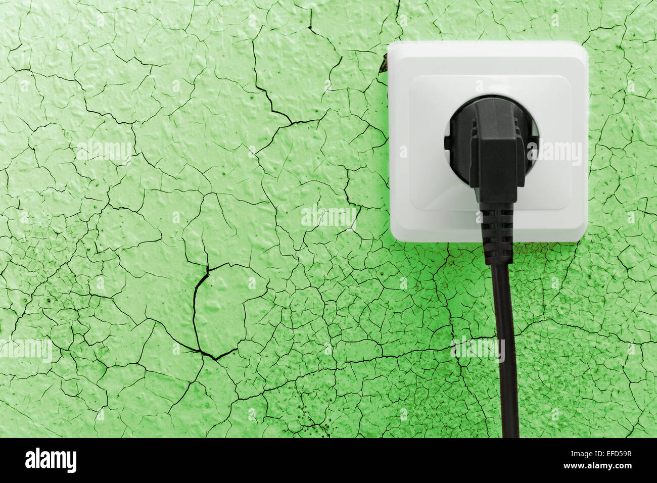 Wall plug socket on cracked colored wall background Stock Photo - Alamy