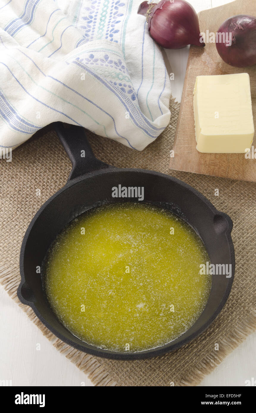 warm melted butter in a cast iron pan Stock Photo - Alamy