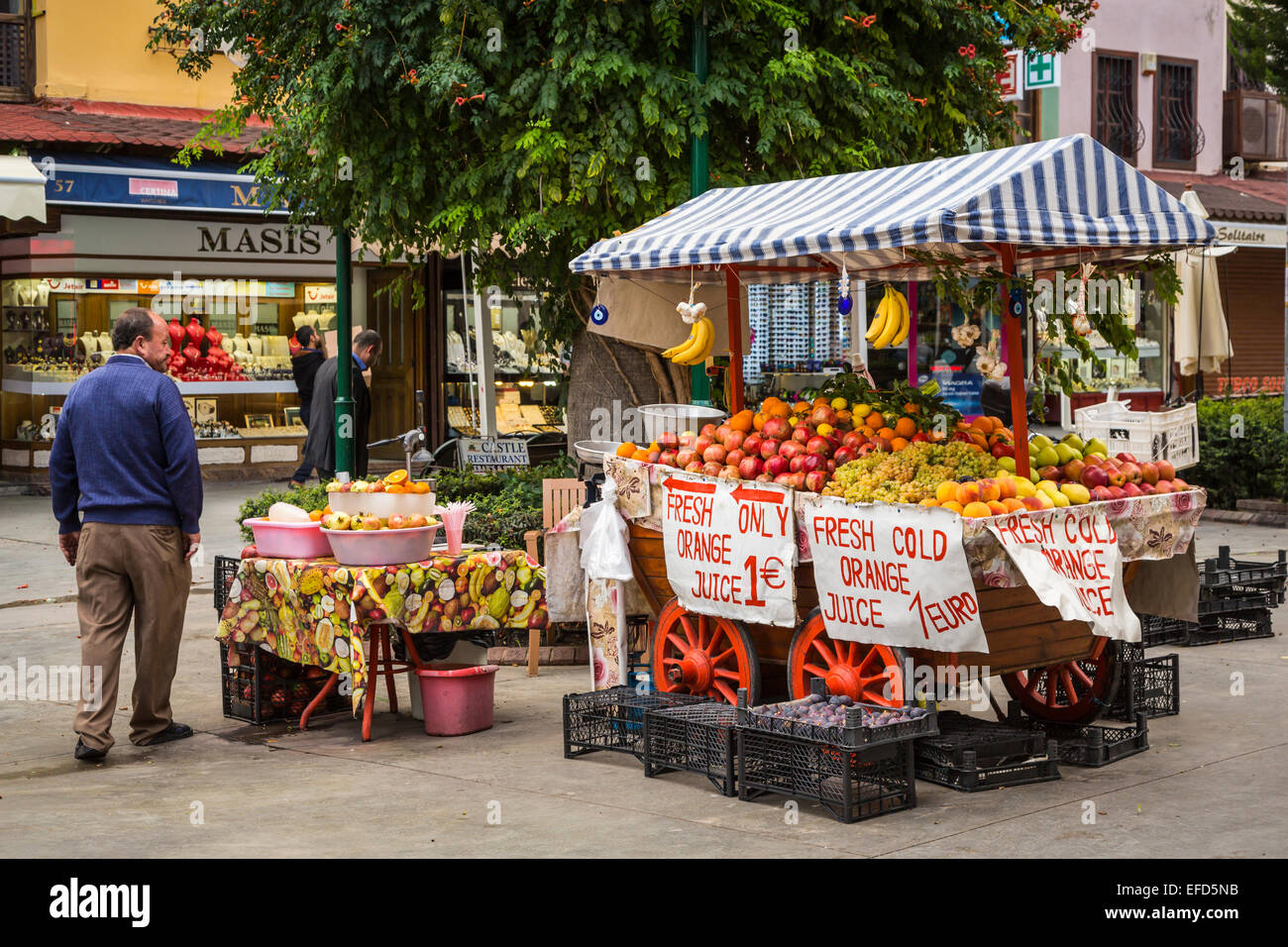 A portable fruit stand kiosk in the outdoor market of Kusadasi, turkey ...