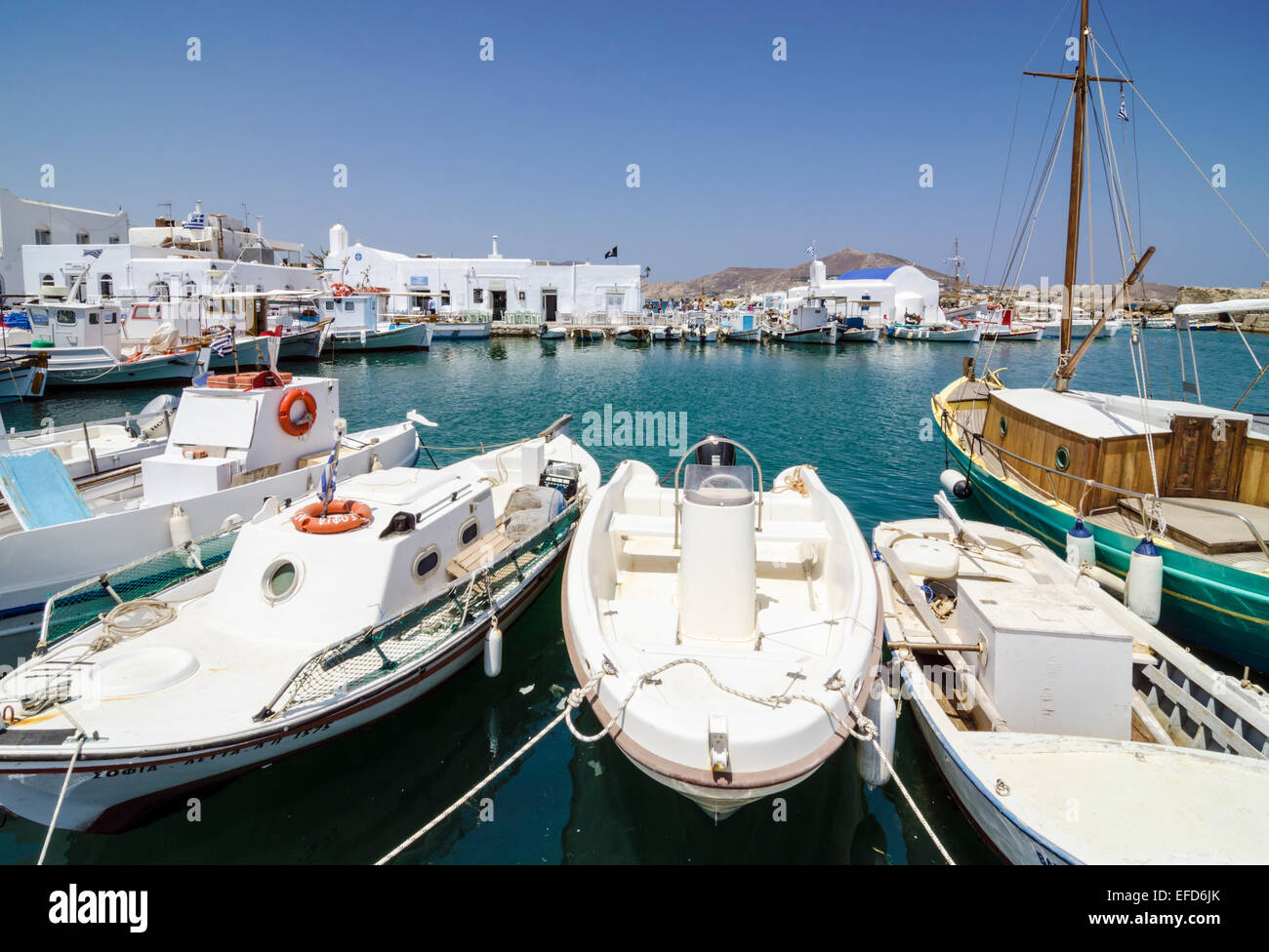 Picturesque boat lined waterfront of Naoussa Town, Paros Island ...