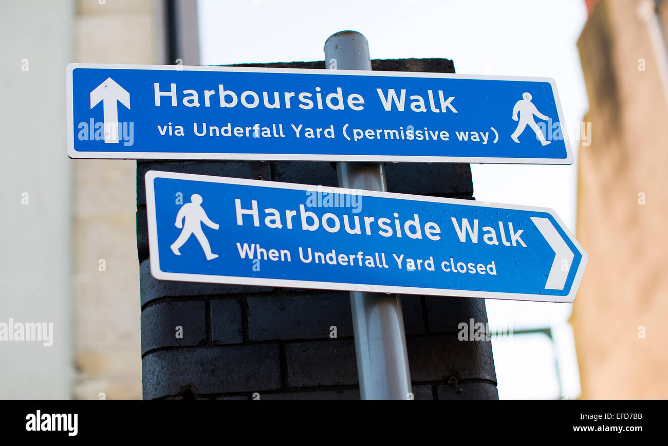 Blue signs for the Harbourside Walk via Underfall Yard in Bristol Stock ...