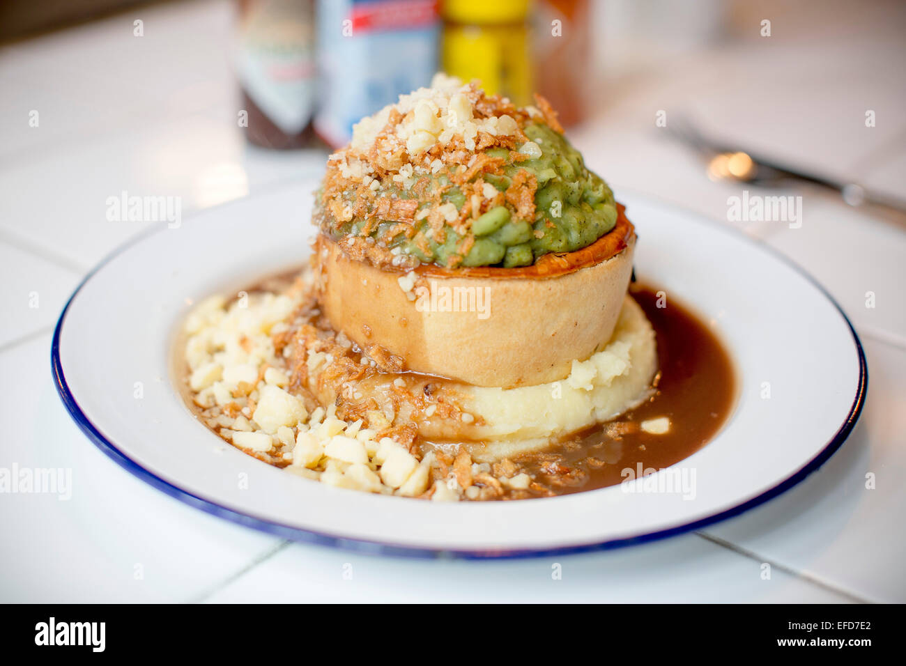 Pieminister pie served with mashed potato, mushy peas, onions and ...
