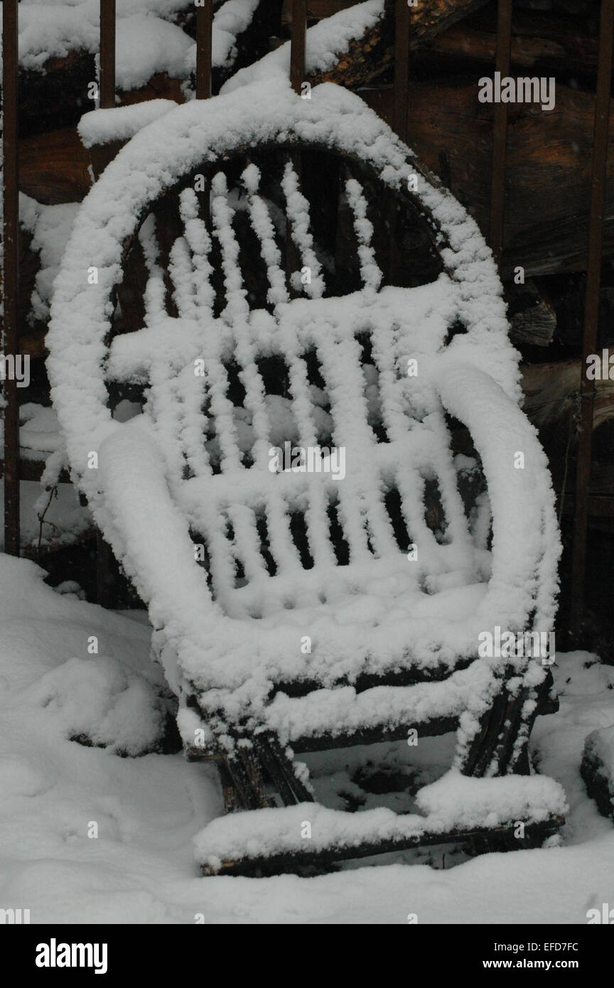 Garden chair covered in winter snow Stock Photo - Alamy