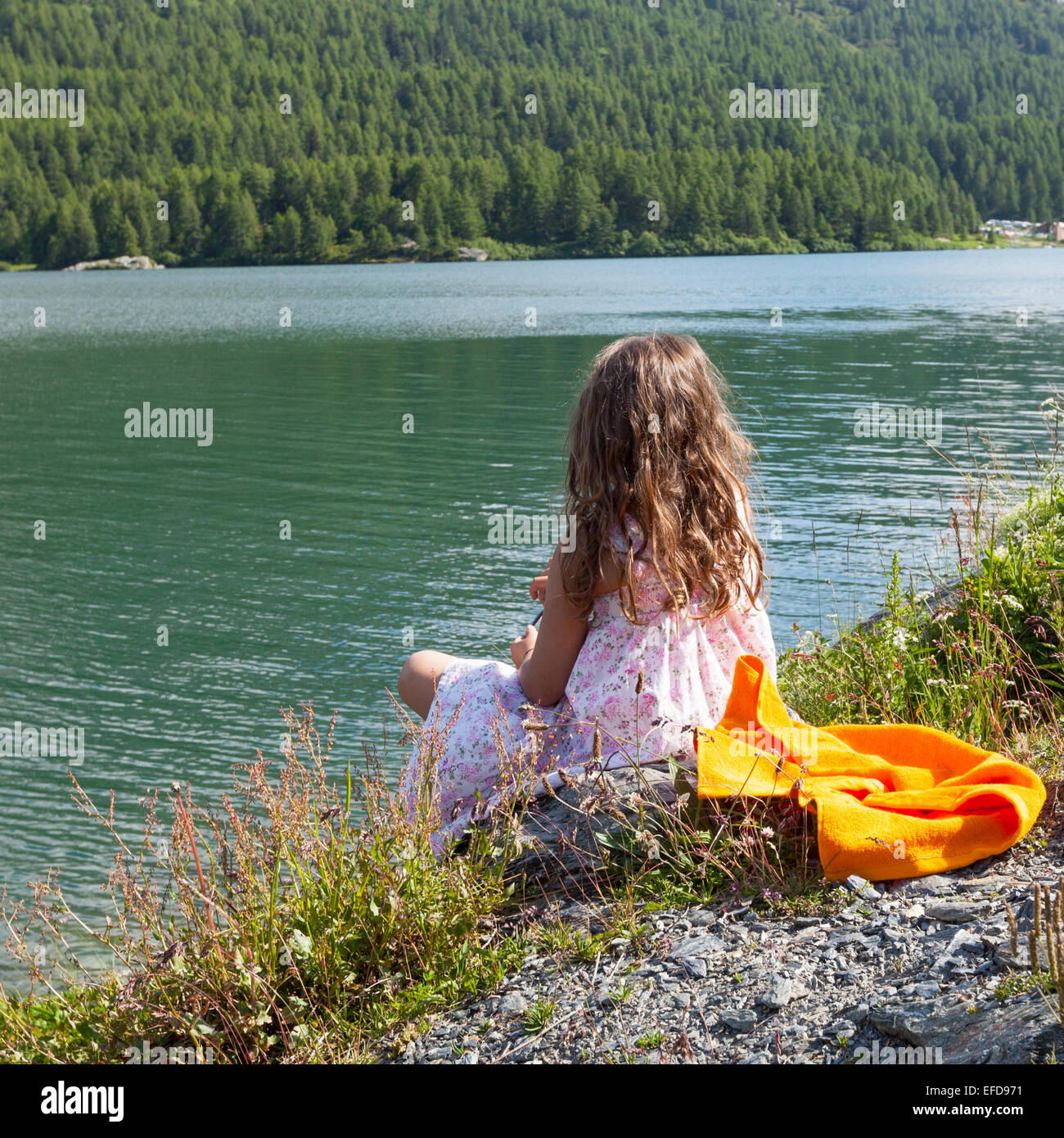 girl on the shore of a mountain lake Stock Photo - Alamy