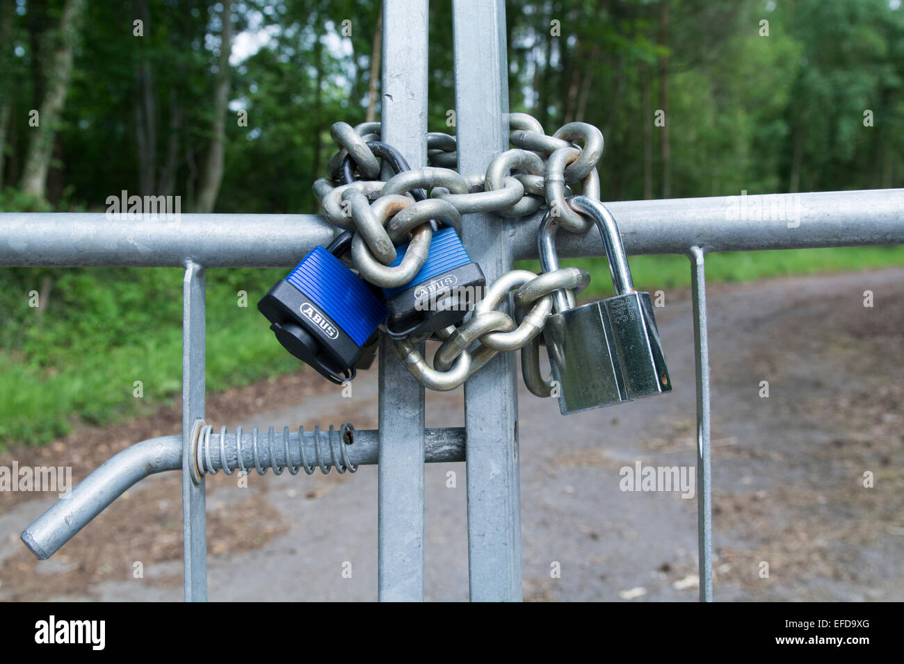 Gates securely locked with chain and padlocks, UK Stock Photo - Alamy
