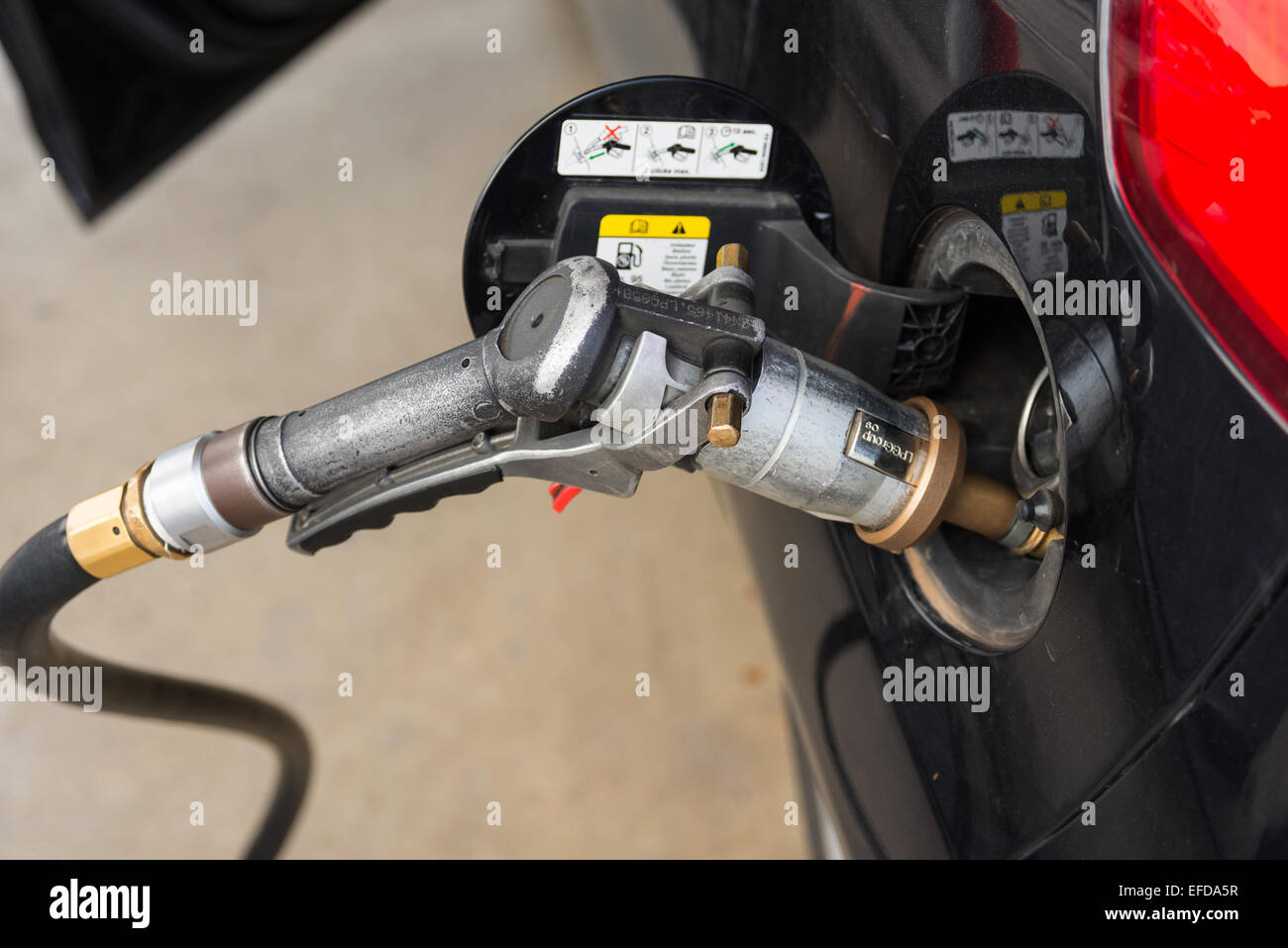 Fuel gun during liquid gas propane refill Stock Photo - Alamy