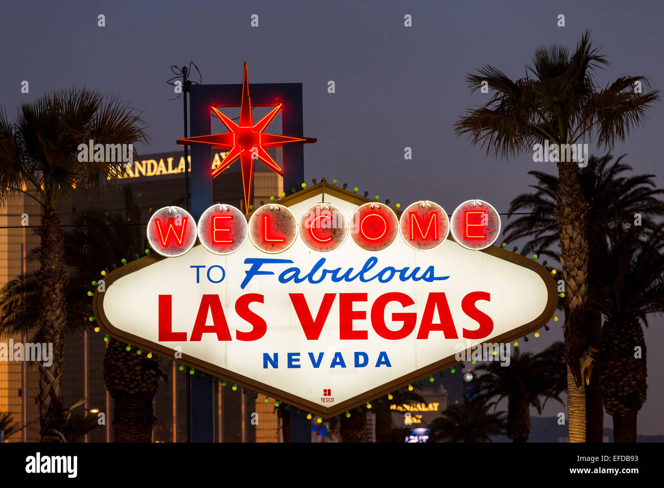 Famous neon Welcome to Fabulous Las Vegas sign surrounded by palm trees ...