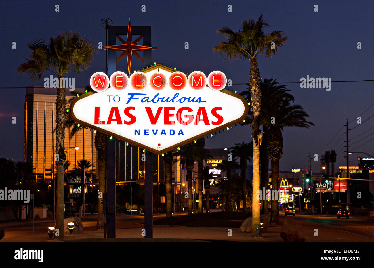 Famous neon Welcome to Fabulous Las Vegas sign surrounded by palm trees ...