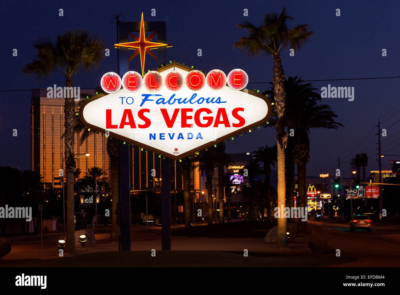 Famous neon Welcome to Fabulous Las Vegas sign surrounded by palm trees ...