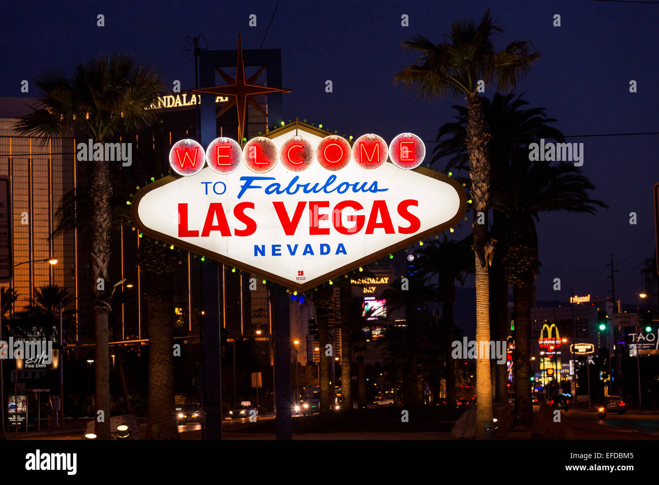 Famous neon Welcome to Fabulous Las Vegas sign surrounded by palm trees ...